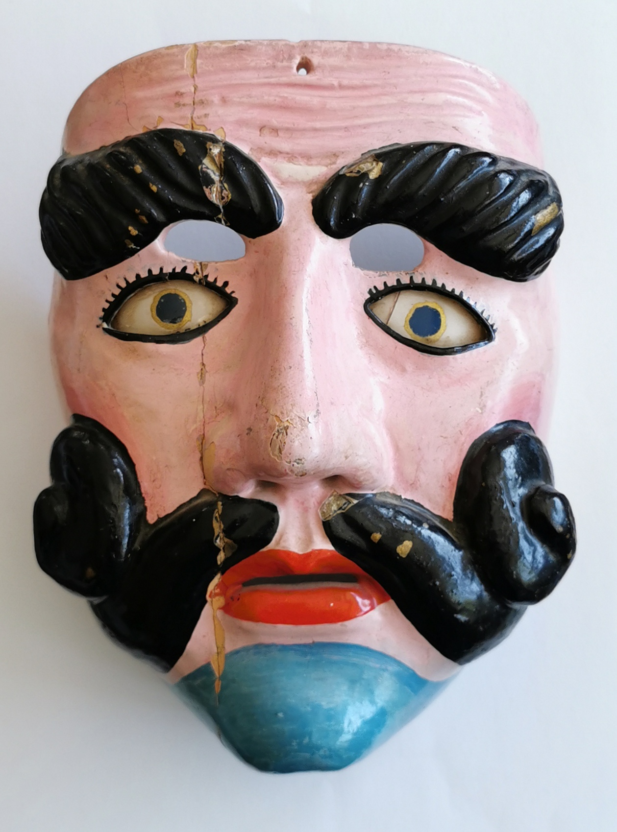 Expert repairs on a mask – Masks of the World
